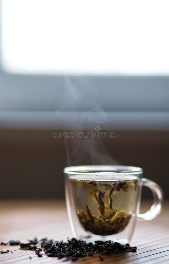 Hot Steamy Green Tea in Front of a Window Glass Stock Image - Image of ...