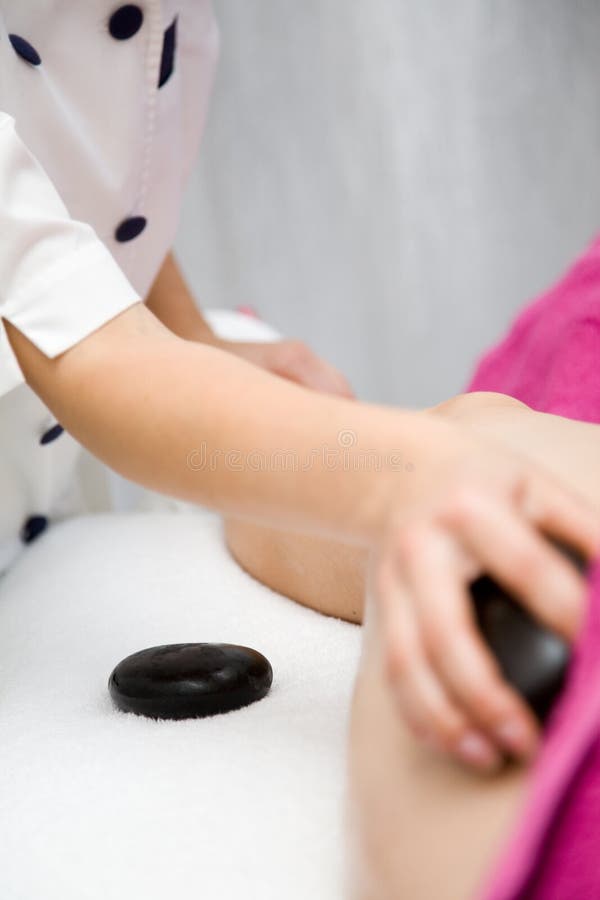 Hot stone massage stock photo. Image of hand, dayspa - 16681288