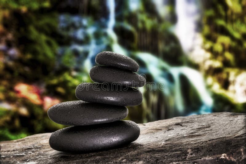 Massage Stones on Stone Underground in Front of a Waterfall Stock Image ...