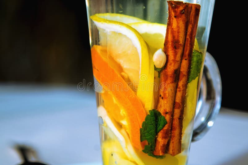 Hot Tea with Cinnamon Bark, Lemon and Green Leaves Stock Image - Image ...