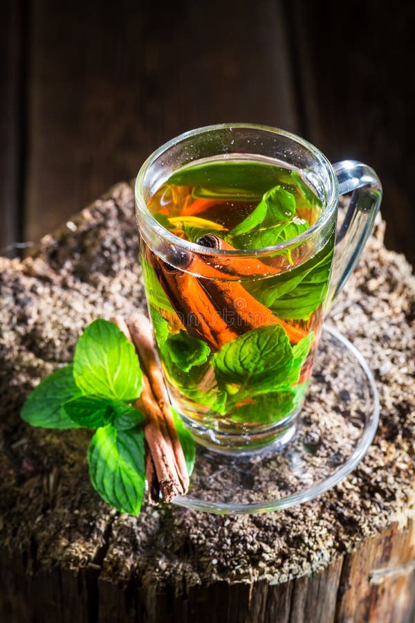 Hot Tea with Green Leaves and Cinnamon Bark Stock Photo - Image of warm ...