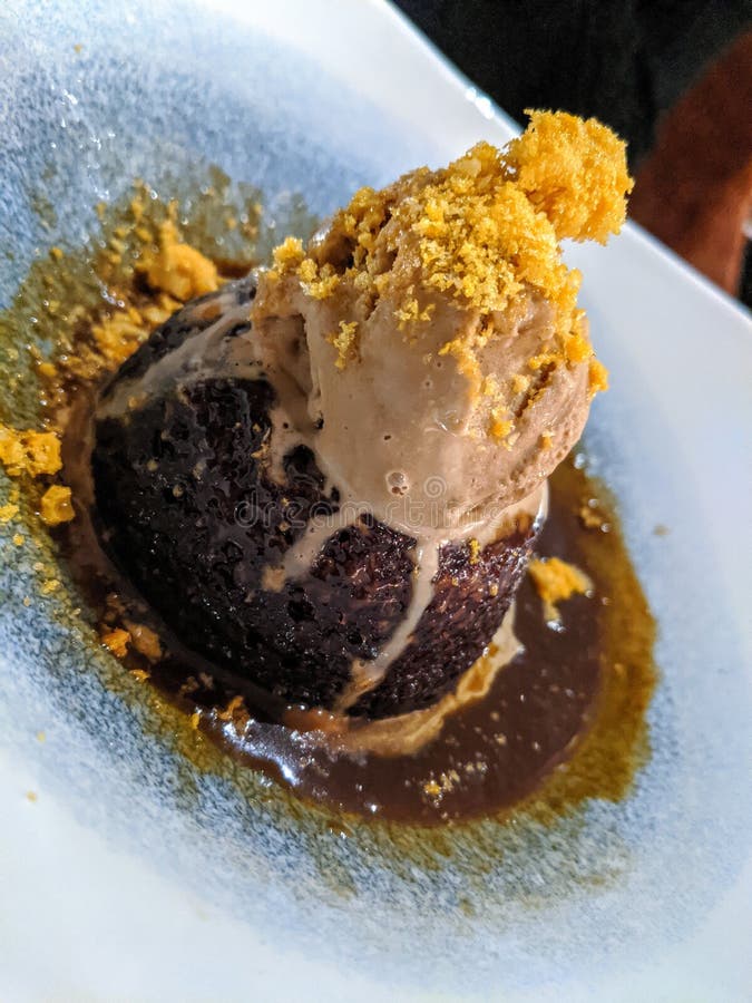 Hot Toffee Pudding with Caramel Ice-cream Stock Image - Image of baking ...