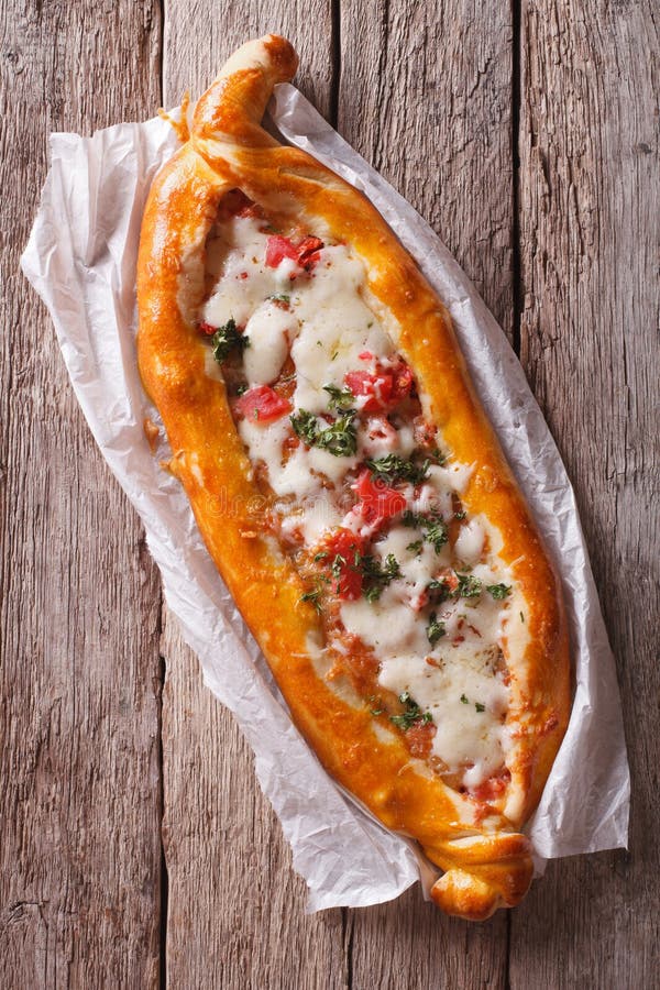 Hot Turkish Pide Pizza Closeup on a Table. Vertical Top View Stock ...
