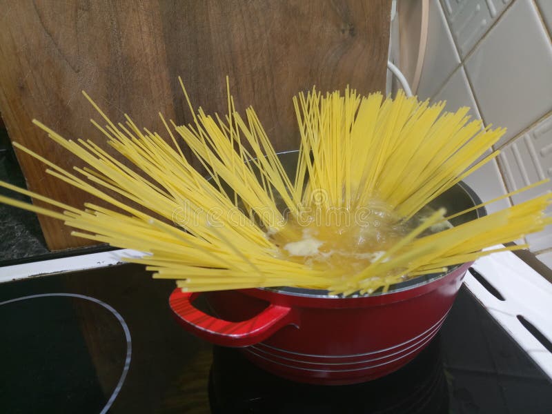 Close Up of Uncooked Spaghetti Boiling in a Pot Stock Photo - Image of ...