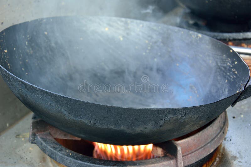 Hot Wok on a stove stock image. Image of flame, cooking - 54504893