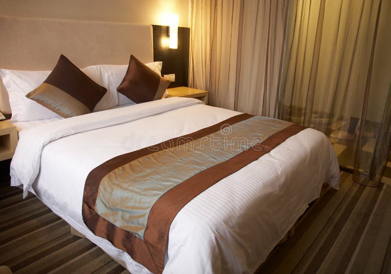 Hotel bed stock image. Image of lights, decor, cozy, lamp - 7826149