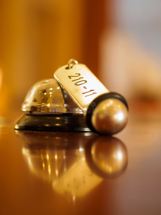 Hotel Bell and Key Lying on the Desk Stock Image - Image of handover ...
