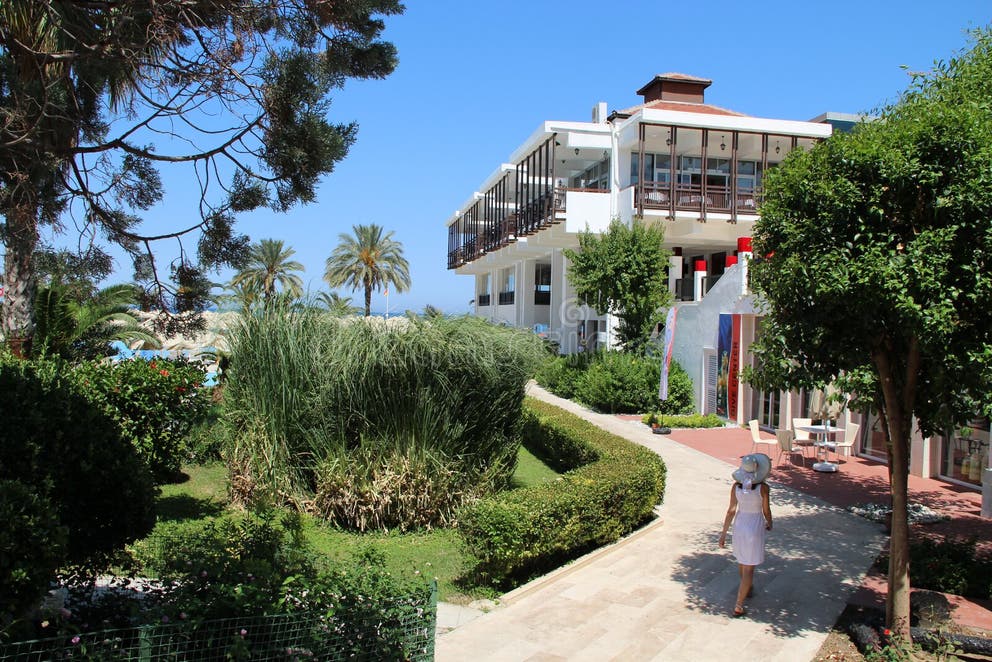 Hotel Building among Palm Trees in a Resort Stock Image - Image of ...
