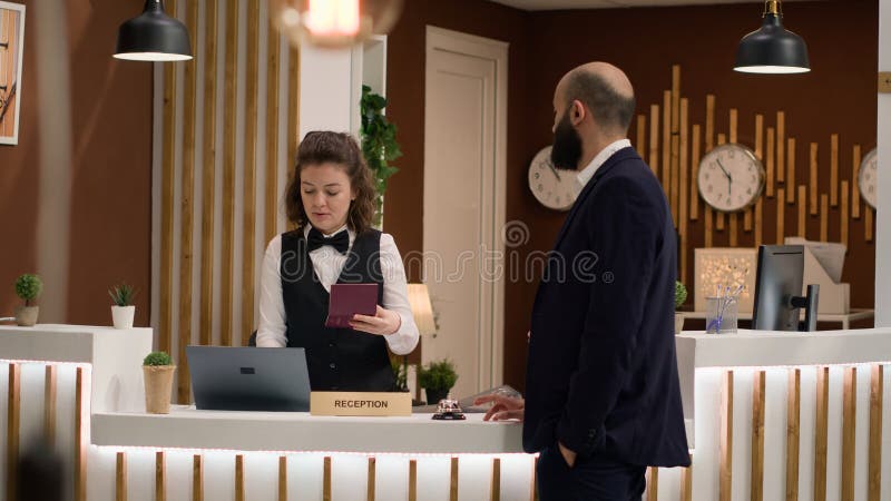 Hotel Concierge Verifying Passport Id Stock Image - Image of guest ...