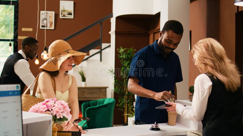 Hotel Guests Checking in at Reception Stock Image - Image of documents ...