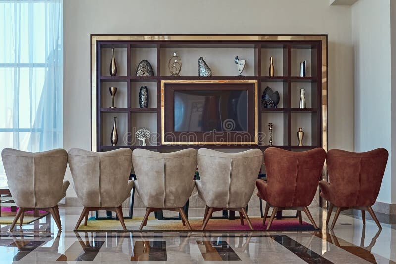 Hotel Lobby Interior. Row of Armchairs in Front of the TV for Relaxing ...