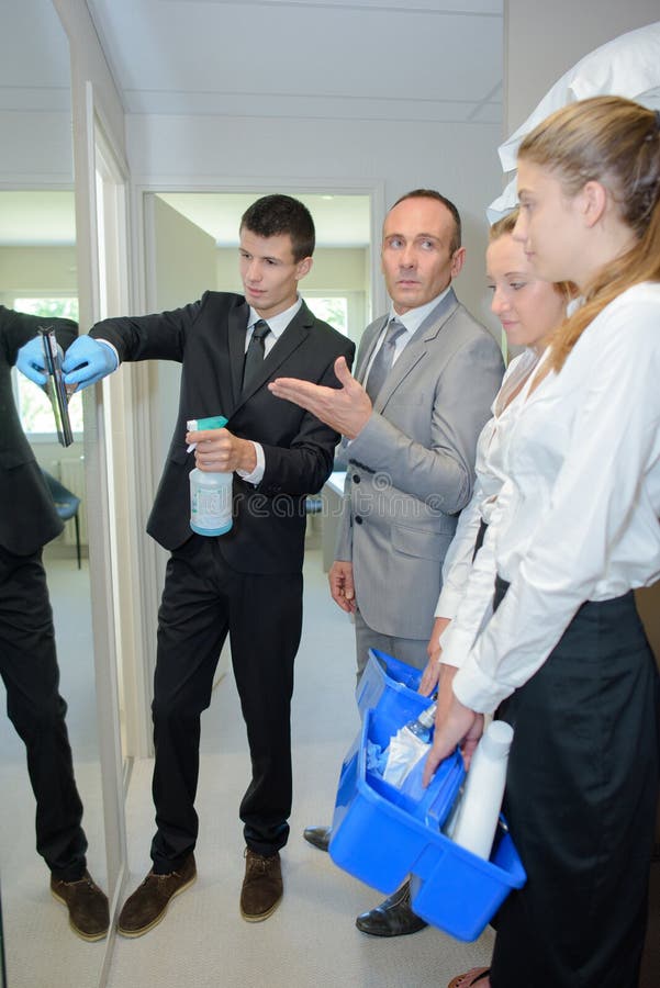 Hotel Manager Guiding Room Service Team Stock Image - Image of room ...