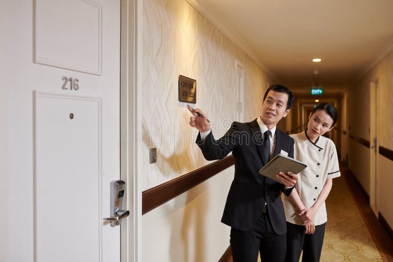 Hotel Manager Talking To Maid Stock Image - Image of instruct, staff ...