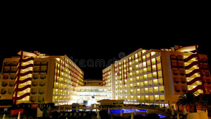 Hotel with Illuminated Swimming Pool at Night Stock Photo - Image of ...