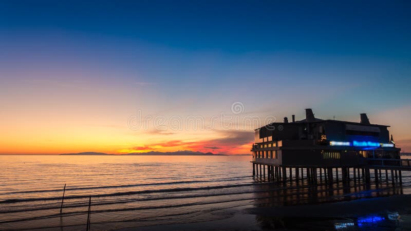 Hotel on piles at dusk stock image. Image of sunrise - 48549451