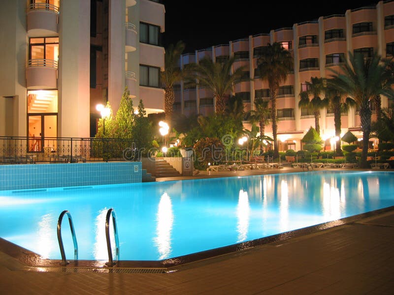 Hotel pool at night stock photo. Image of sunshine, building - 9469656