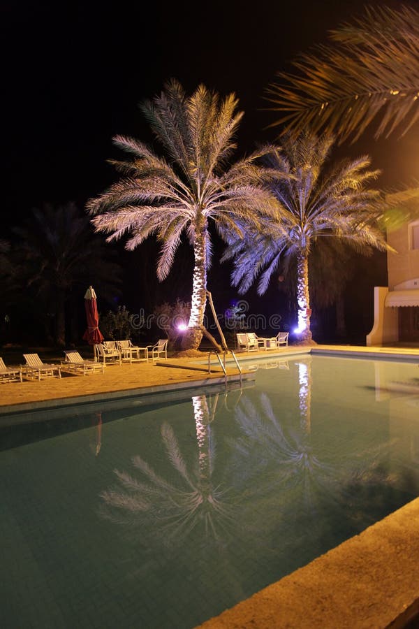 Hotel pool at night stock image. Image of recreational - 92901985