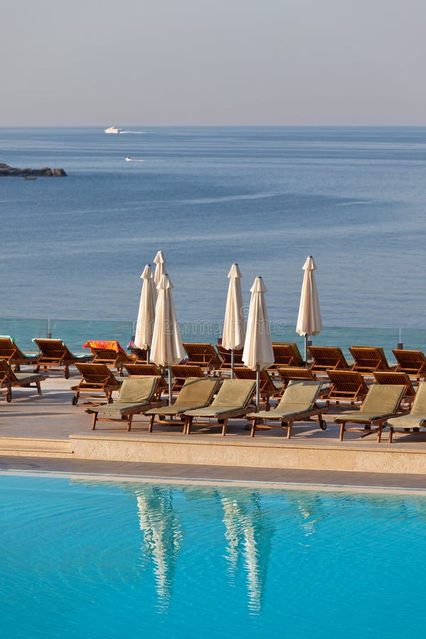 Hotel Poolside Chairs with Sea View Stock Image - Image of location ...