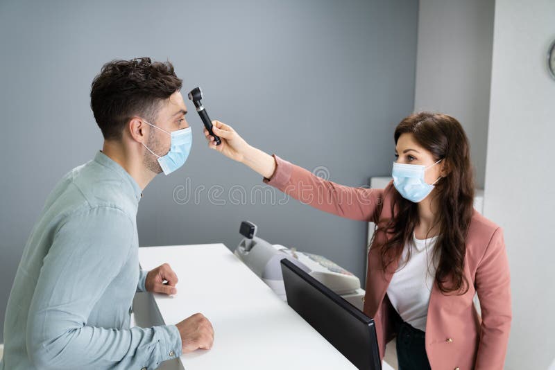 Hotel Reception Desk Temperature Check Stock Photo - Image of fever ...