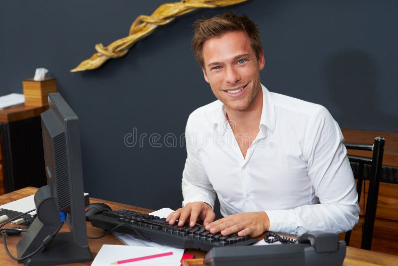 Hotel Receptionist Working at Computer Stock Photo - Image of worker ...