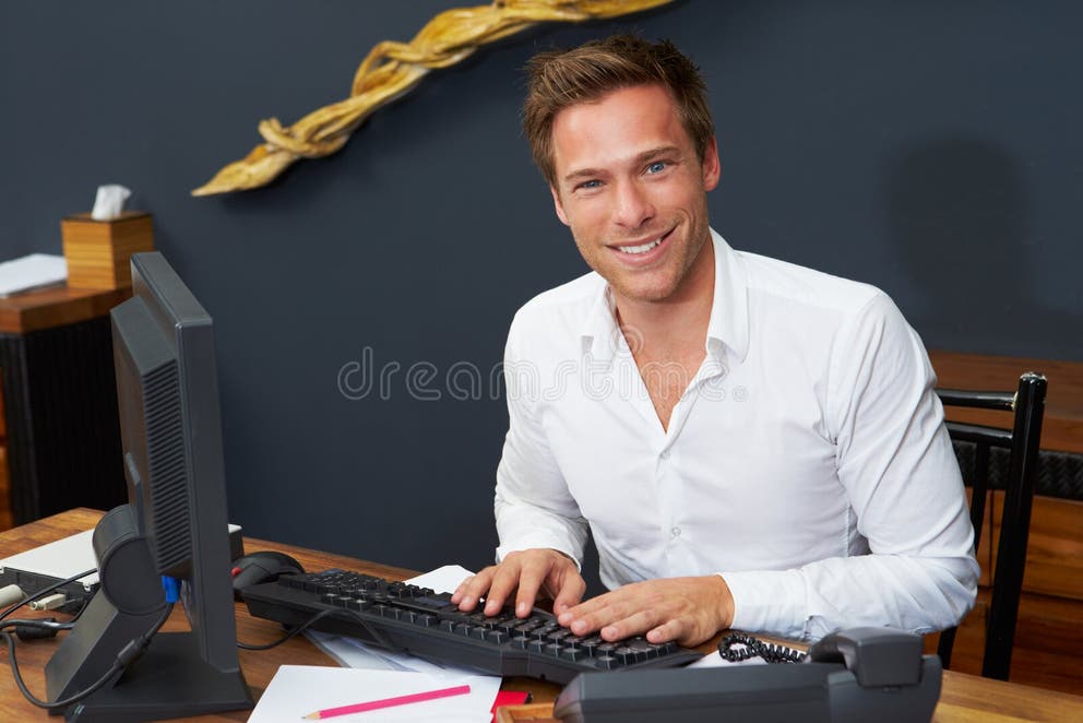 Hotel Receptionist Working at Computer Stock Photo - Image of worker ...