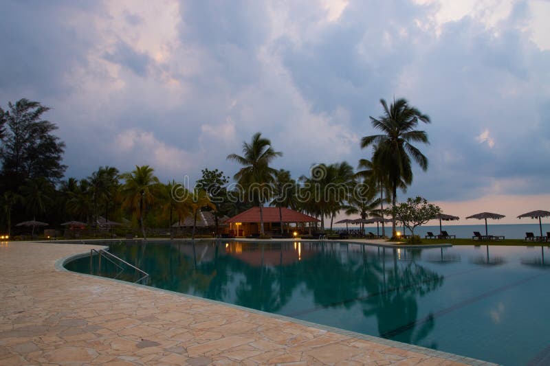 A Hotel or Resort Pool at Dusk Stock Image - Image of dusk, swimming ...