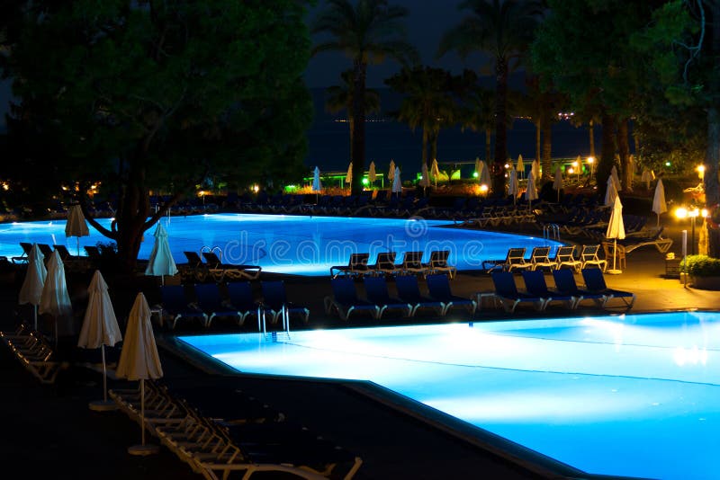 Hotel And Resort Swimming Pool At Night Stock Photo - Image of luxury ...