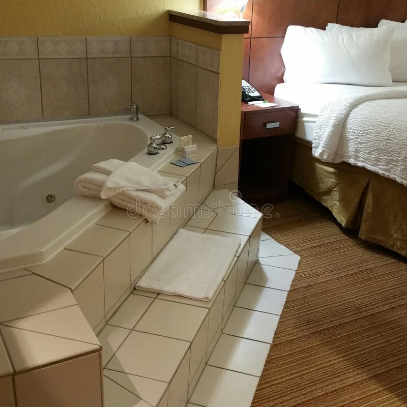 Hotel Room Bed and Bath Combo Stock Photo - Image of room, bathroom ...