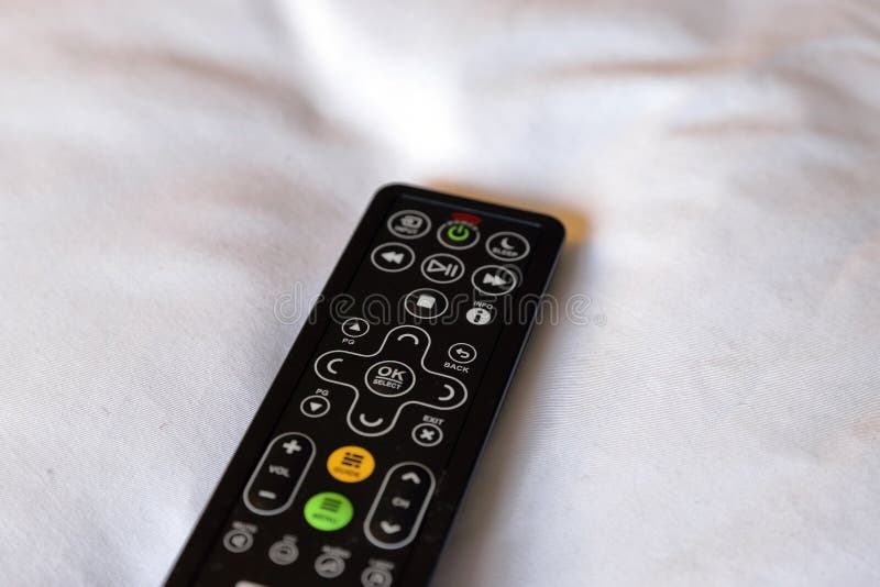 Hotel Room Remote Control on White Bedding Stock Image - Image of ...