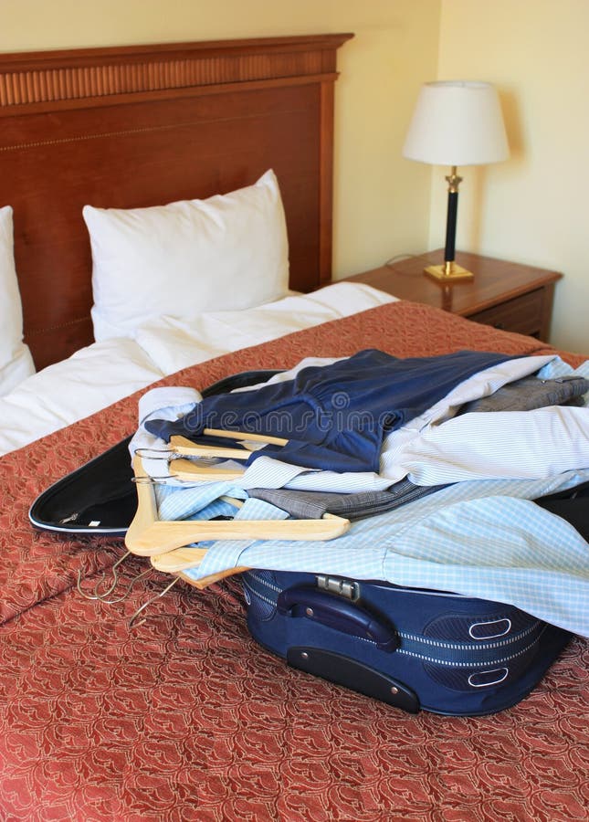 Hotel Room with Suitcase and Clothes Stock Photo - Image of flight ...