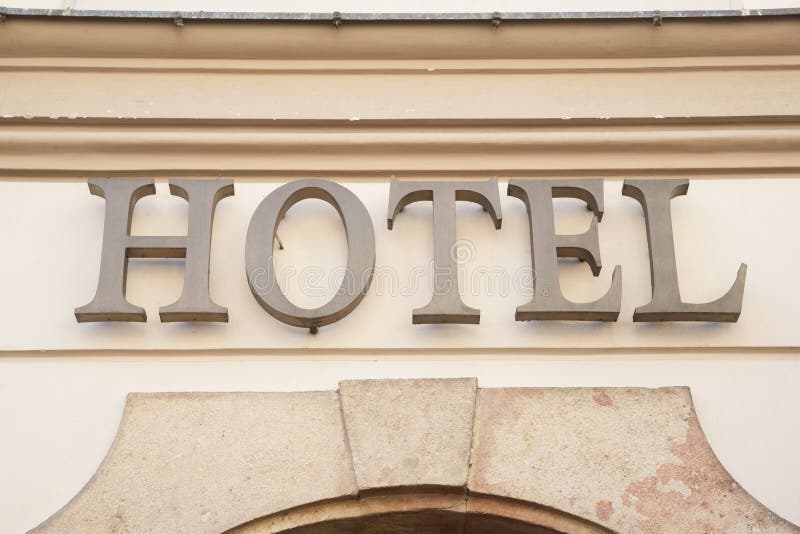 Gold Hotel Sign on White Wall Background Stock Photo - Image of ...