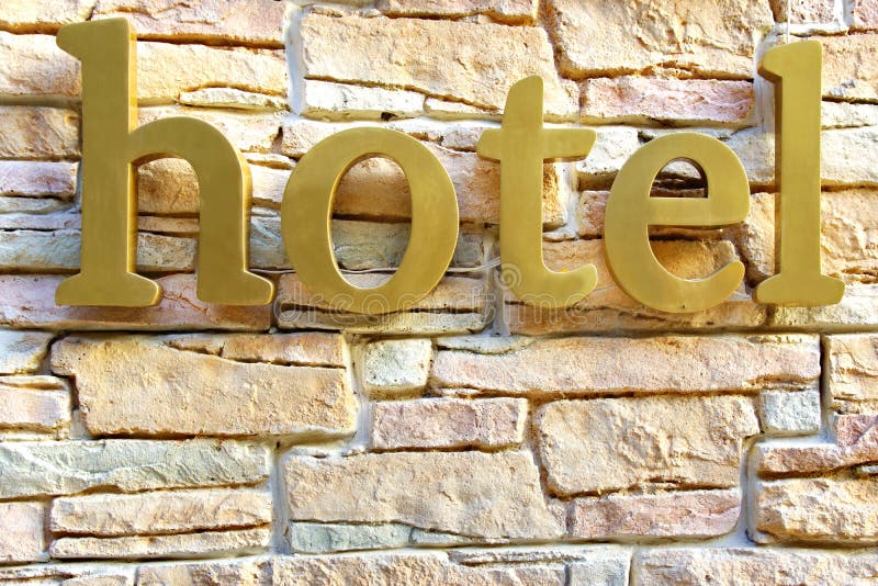 Hotel Sign on Stone Tiled Wall Stock Image - Image of structure ...