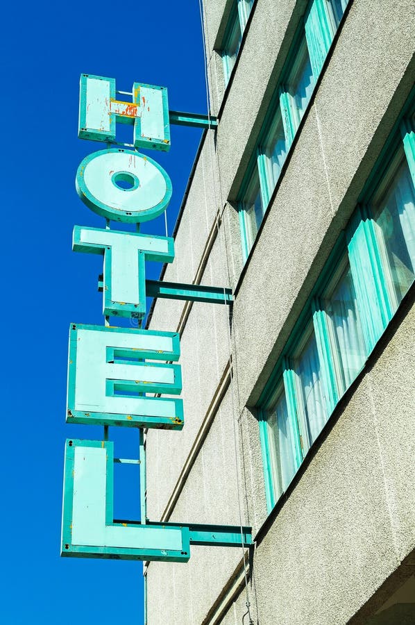 Hotel sign stock image. Image of wall, blue, sign, green - 61789861