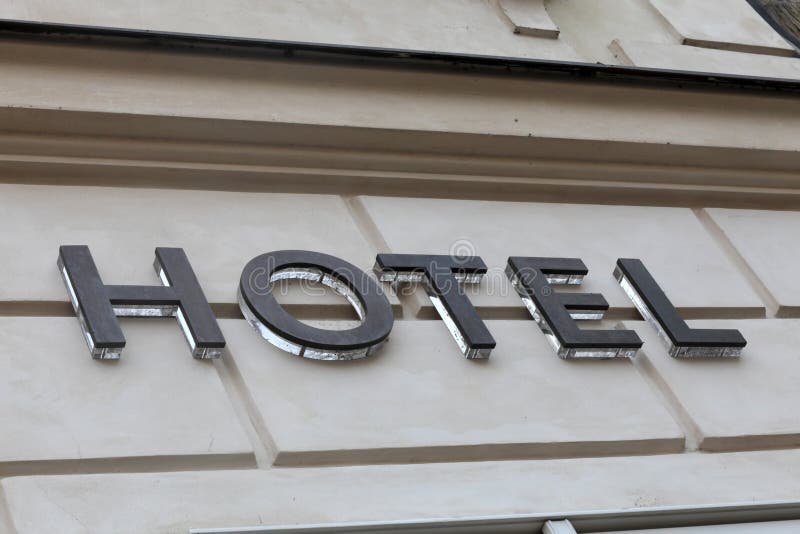 Hotel Sign on Concrete Wall Stock Image - Image of gray, district ...