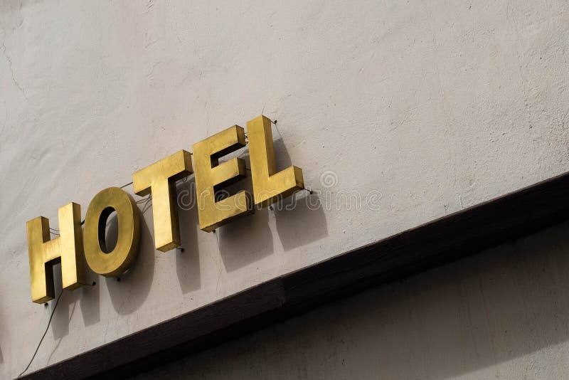 Hotel Sign on Wall Exterior Stock Photo - Image of banner, signage ...