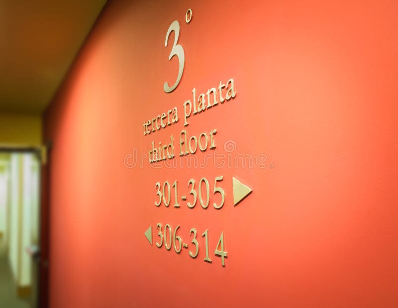 Hotel Signs Directions in a Red Wall Stock Image - Image of resident ...