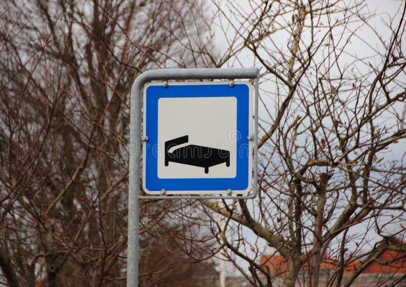 Hotel Sleeping Metal Sign Closeup in White and Blue Stock Image - Image ...