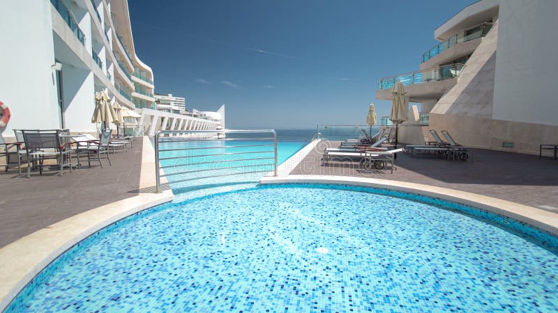 Hotel Small Swimming Pool with Sunny Reflections Timelapse, Sesimbra ... Hotel Small Swimming Pool with Sunny Reflections Timelapse, Sesimbra ...