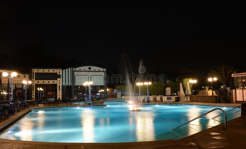 Hotel Swimming Pool at Night Stock Photo - Image of colors, swimming ...