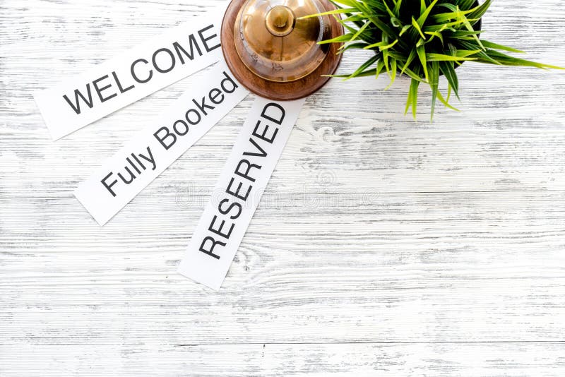 At the Hotel. Words Welcome, Fully Booked, Reserved on Light Wooden ...