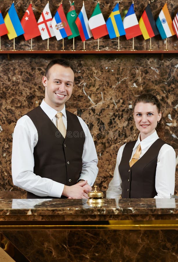 Hotel workers on reception stock image. Image of guest - 43814273