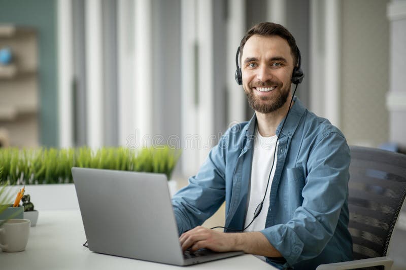 Hotline Operator. Handsome Customer Support Manager Man at Workplace in ...