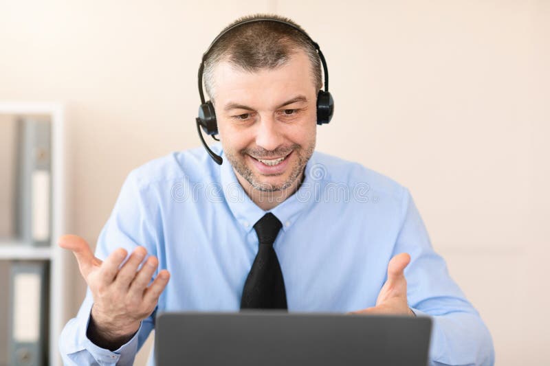 Hotline Operator Talking with Client Making Video Call in Office Stock ...