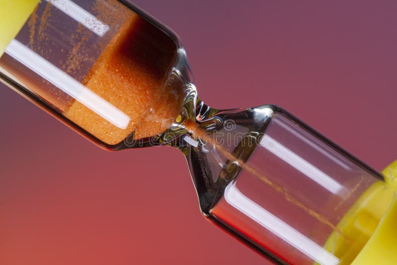 Hour Glass with Running Sand Inside, on Blue Background. Time Passing ...