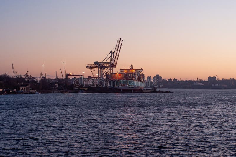 24-hour Seaport Work on Loading Container Ships with Cranes. Loading a ...