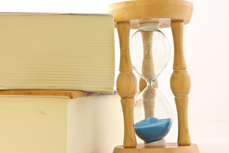 Hourglass with book stock photo. Image of reflection - 37523692
