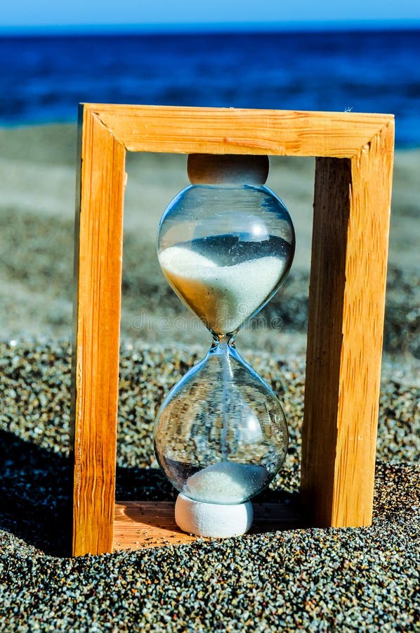 Hourglass Clock on the Sand Beach Stock Photo - Image of time, glass ...