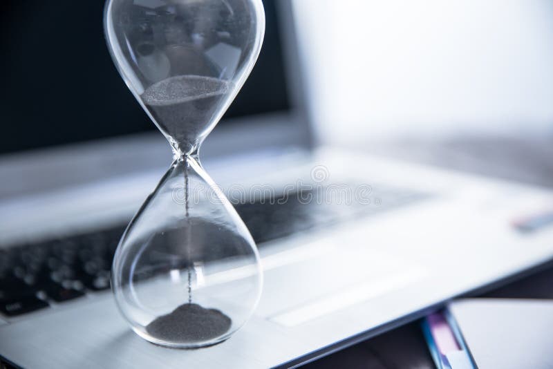 Hourglass on keyboard stock photo. Image of planning - 202807000