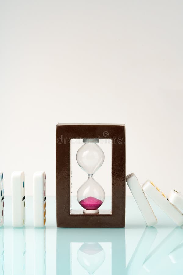 Hourglass and Domino Tiles on Blue Background. Time Limit Concept Stock ...