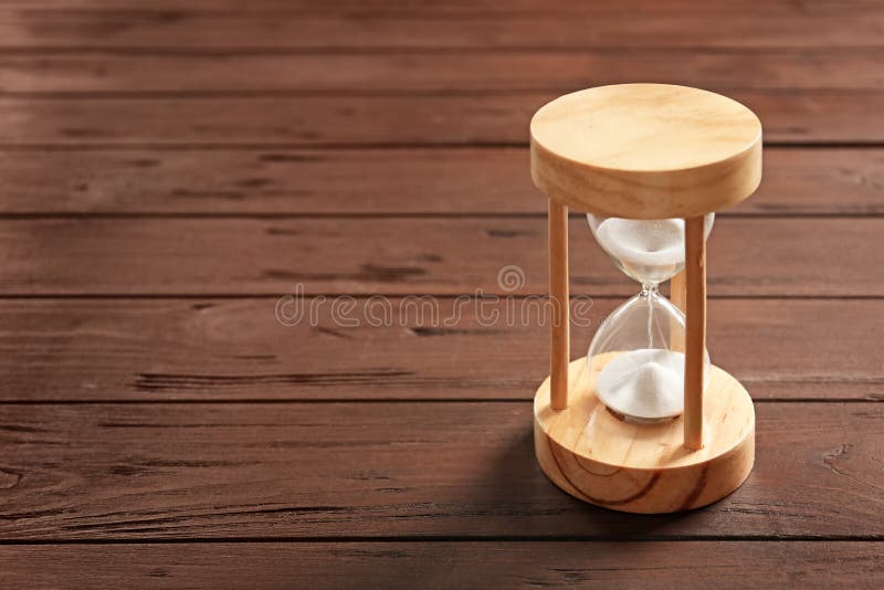 Hourglass with Flowing Sand on Table Stock Image - Image of planning ...